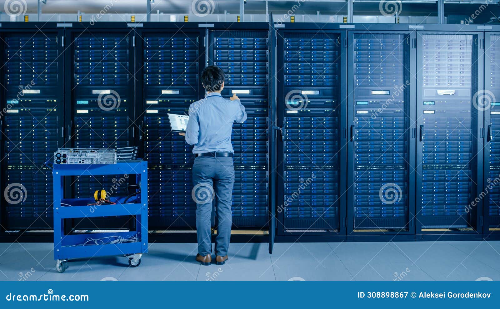 In the Modern Data Center: it Engineer Doing Maintenance and ...