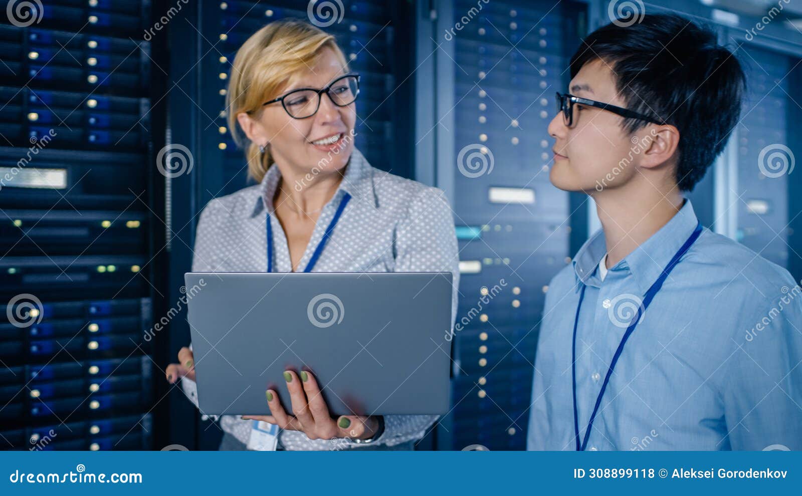 In the Modern Data Center: Engineer and it Specialist Walking Alongside ...