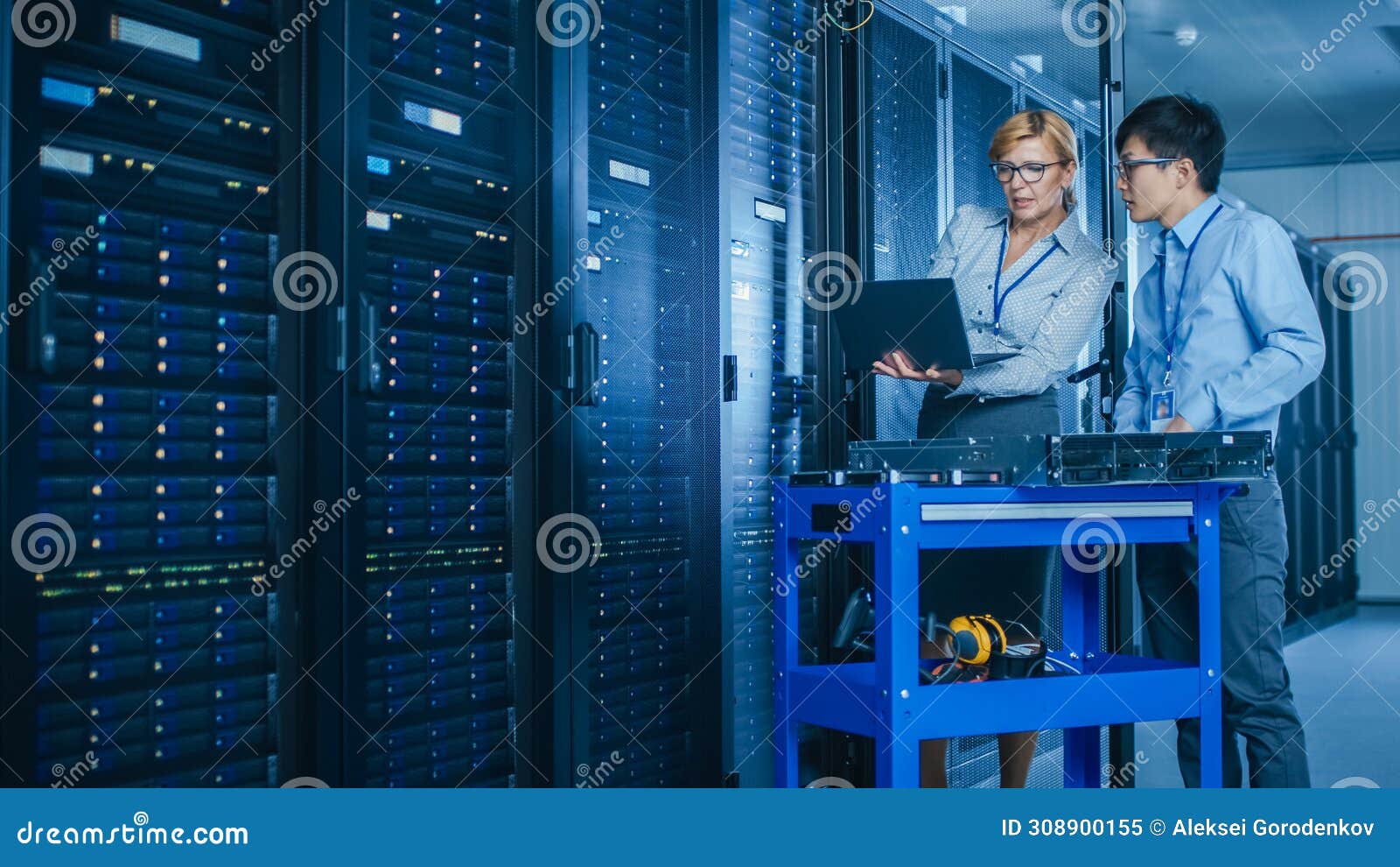 In the Modern Data Center: Engineer and it Specialist Work with Server ...