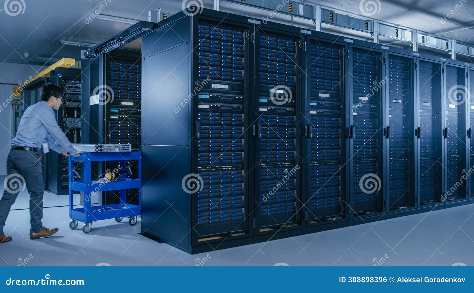 In the Modern Data Center: Team of it Technicians Working with Server ...