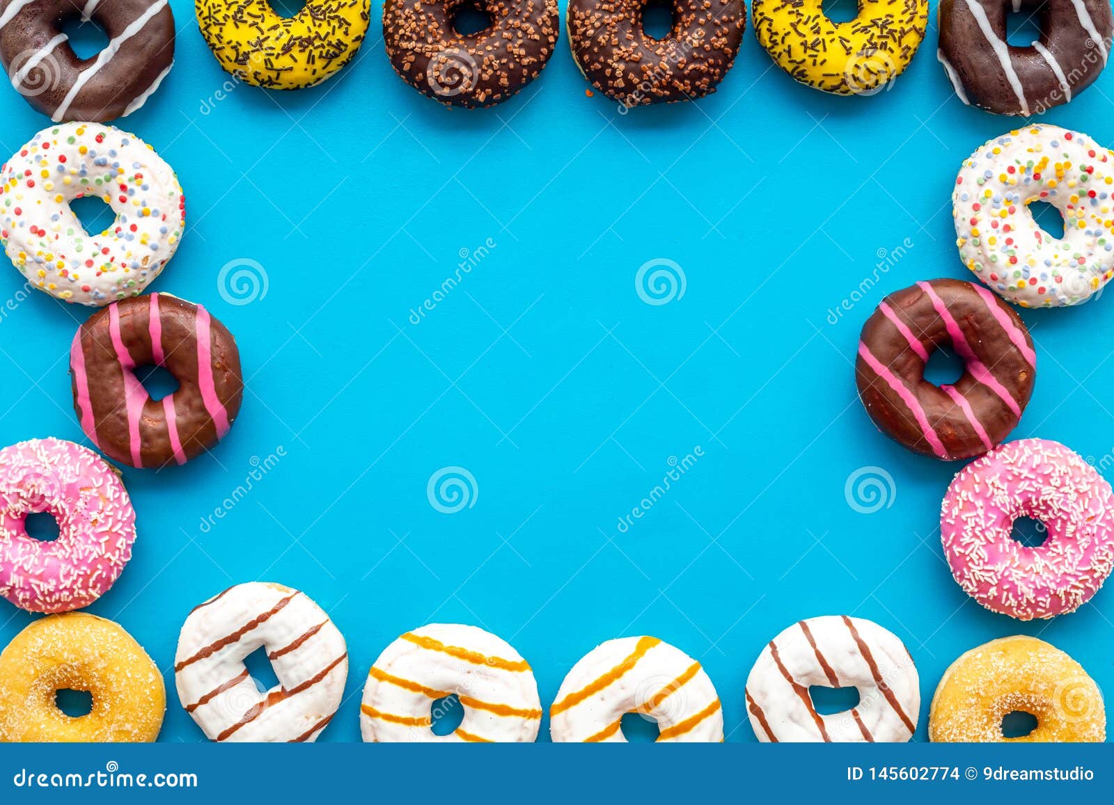 Modern Design with Bright Donuts Frame on Blue Background Top View Mock ...