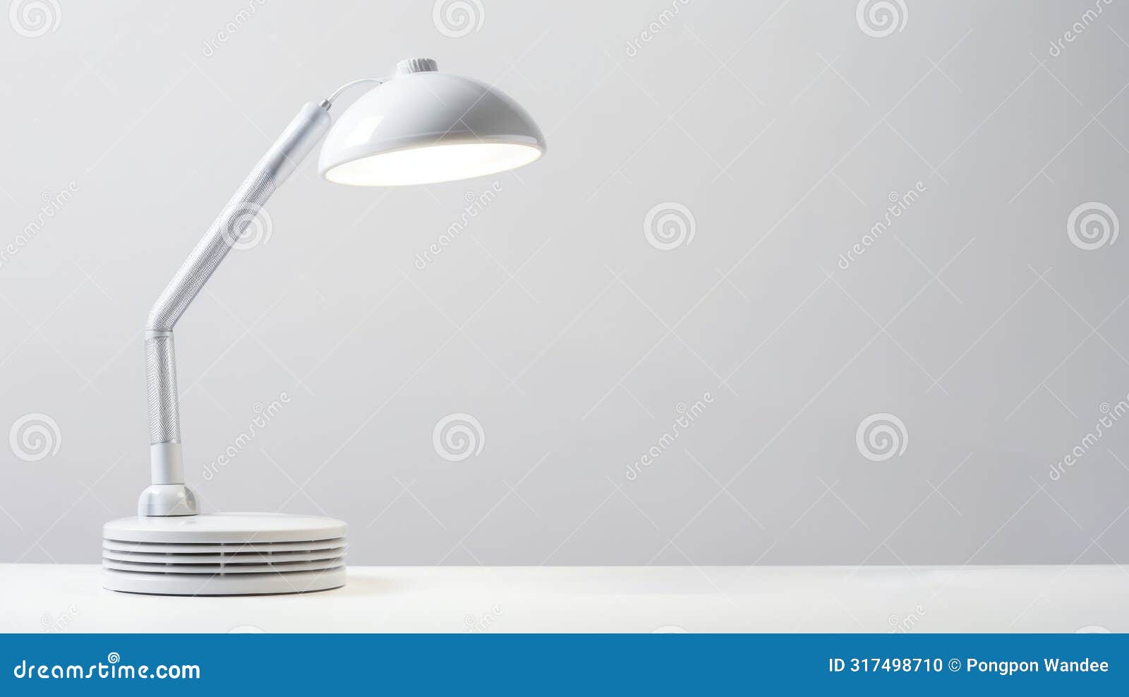 A Modern Desk Lamp With A Flexible Neck On A White Surface, Casting A ...