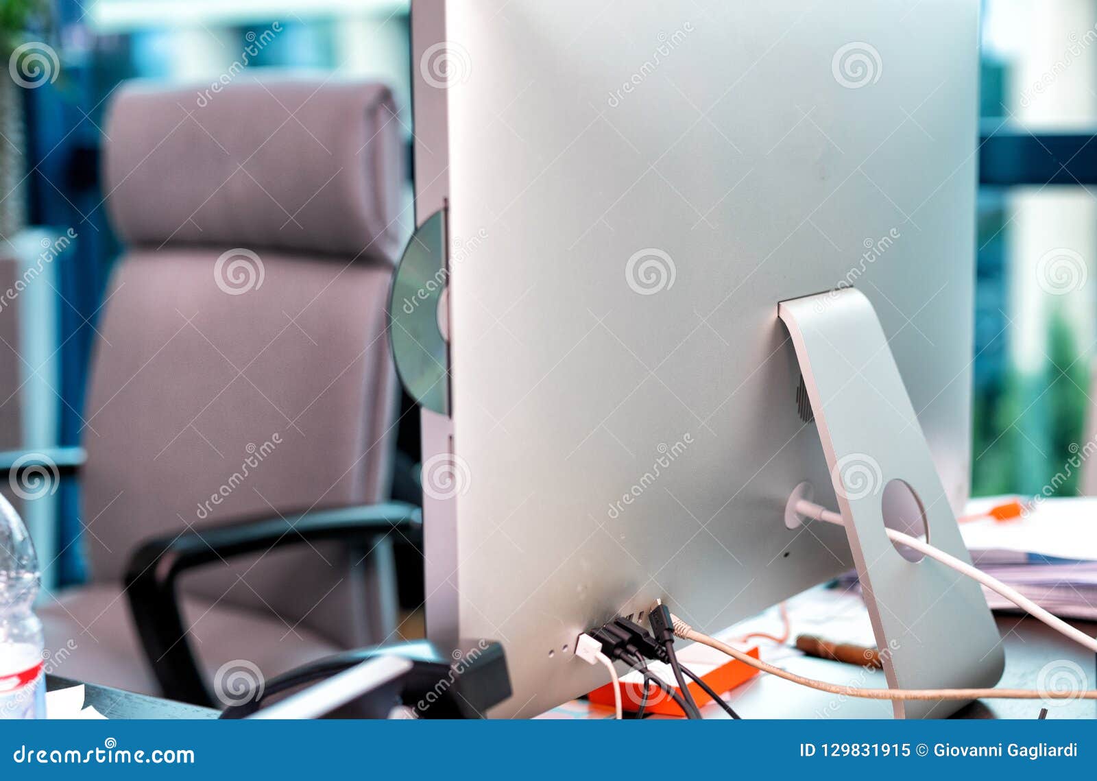 Modern Desktop All-in-one Computer on a Cluttered Business Room Stock ...