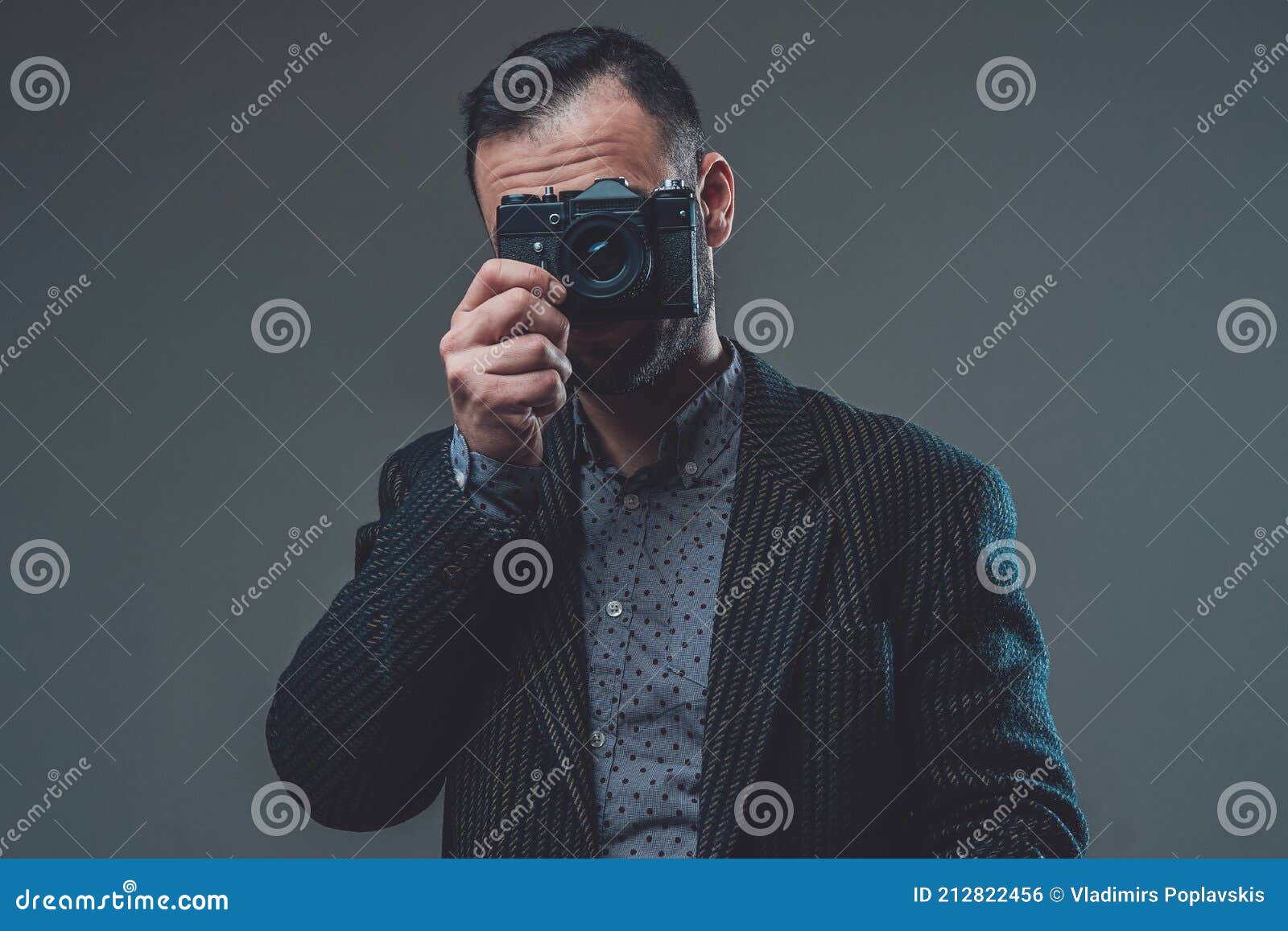 Successful Man Doing Shot with His Photo Camera in Grey Background ...