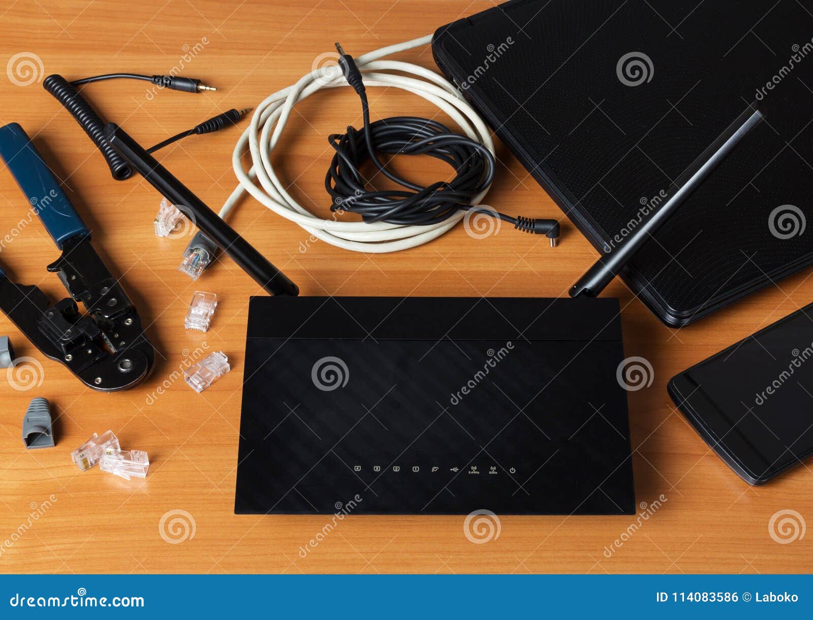 Modern Devices and Router, Modem Connection Parts and Tools on Table ...
