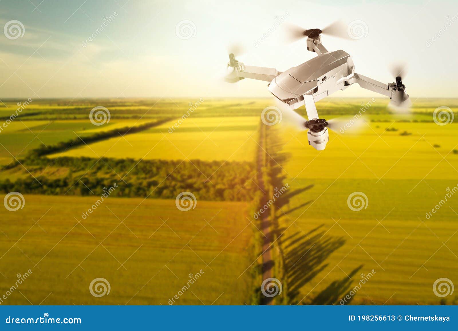 Modern Drone Flying Over Fields on Sunny Day. Aerial Survey Stock Image ...