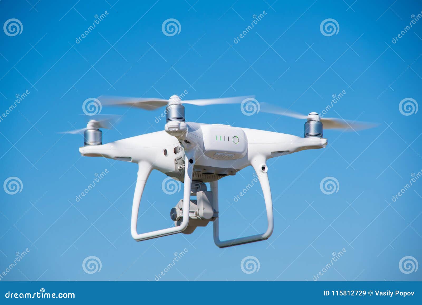 The Modern Drone, Quadrocopter is in the Air Against the Background of ...