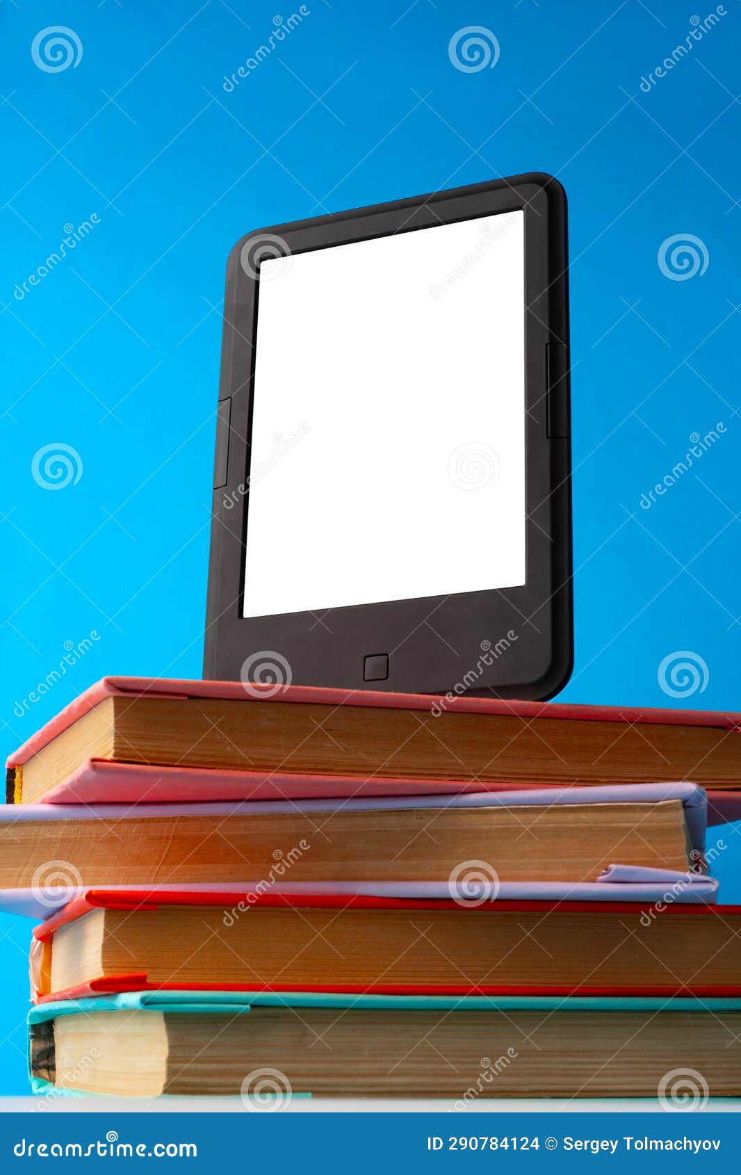 Modern E-book on Stack of Hardcover Books on Blue Background Stock ...