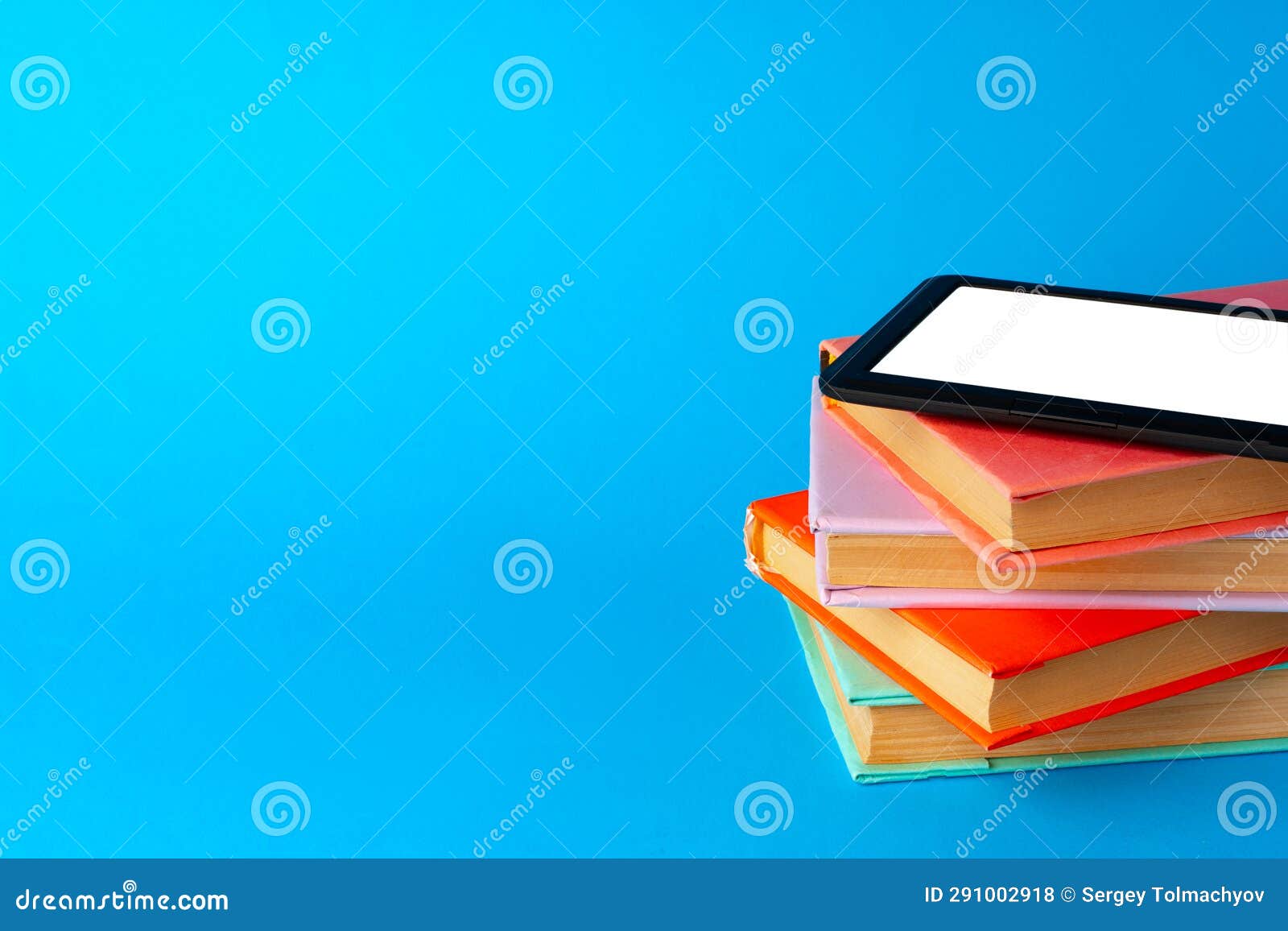Modern E-book on Stack of Hardcover Books on Blue Background Stock ...