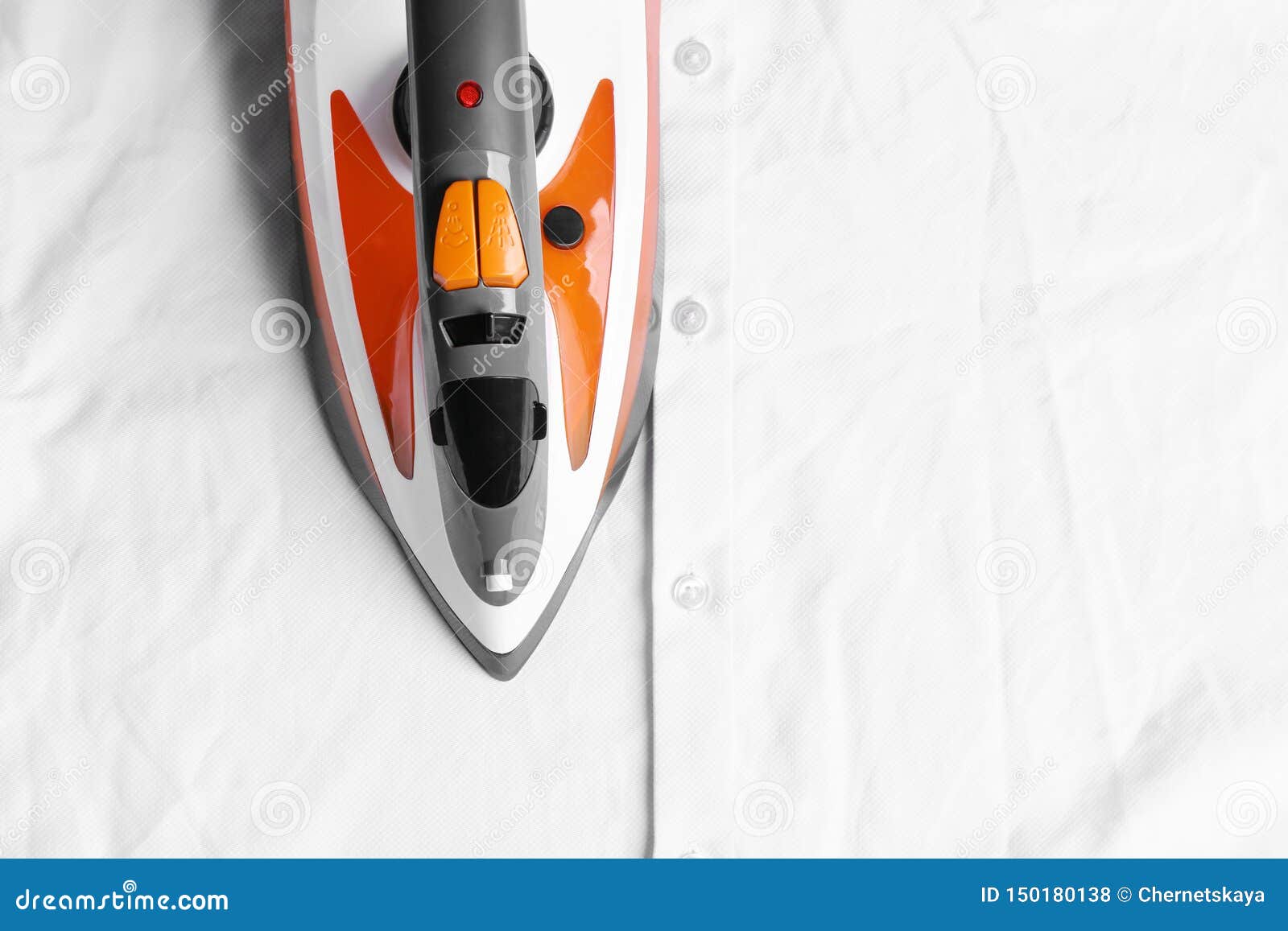 Modern Electric Iron on Wrinkled Cloth, Top View Stock Photo - Image of ...