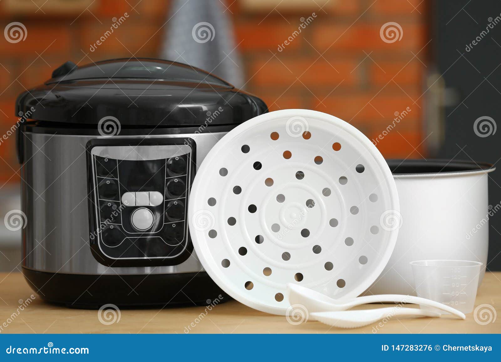 Modern Electric Multi Cooker, Parts and Accessories on Table Stock ...