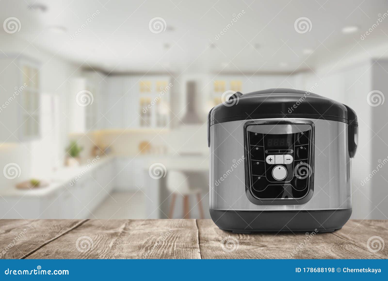 Modern Electric Multi Cooker on Table in Kitchen. Space for Design ...