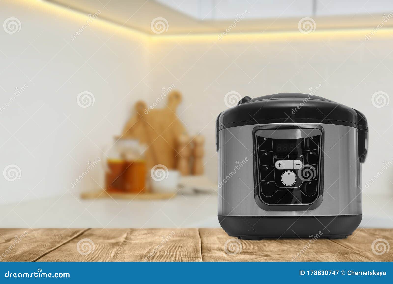 Modern Electric Multi Cooker on Table in Kitchen. Space for Design ...