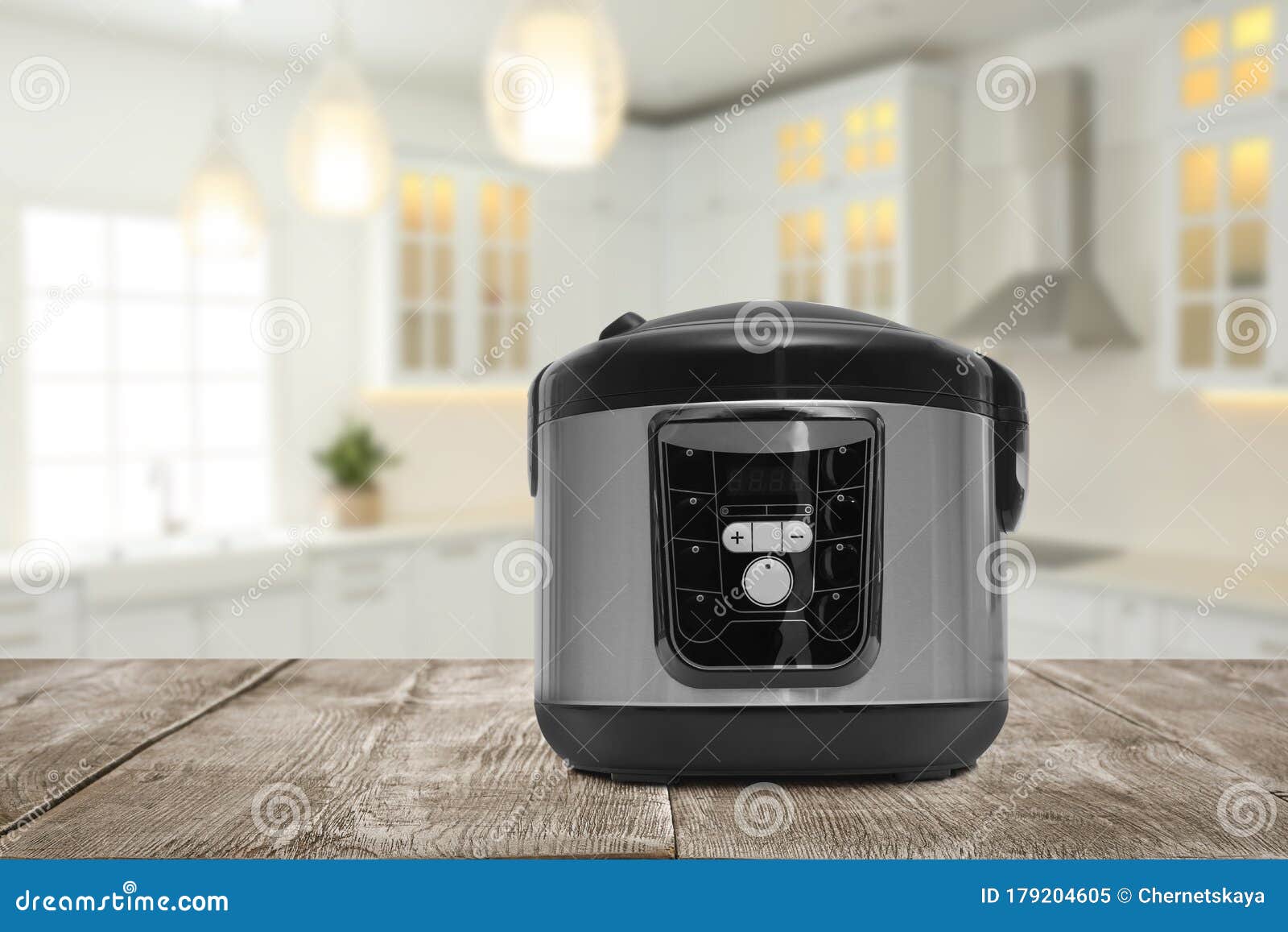 Modern Electric Multi Cooker on Table in Kitchen. Space for Design ...