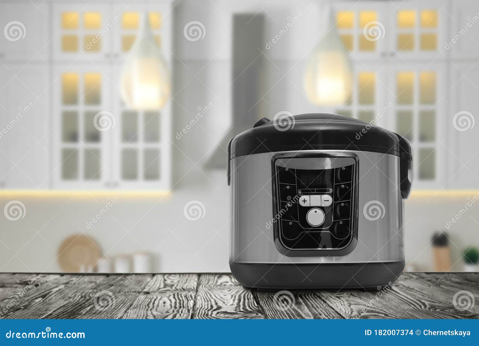 Modern Electric Multi Cooker on Table in Kitchen. Space for Design ...