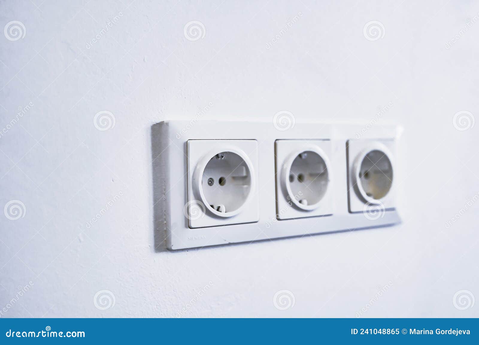 Close-up Of Two Triple Wires For Electrical Outlets On A Bare Wall ...