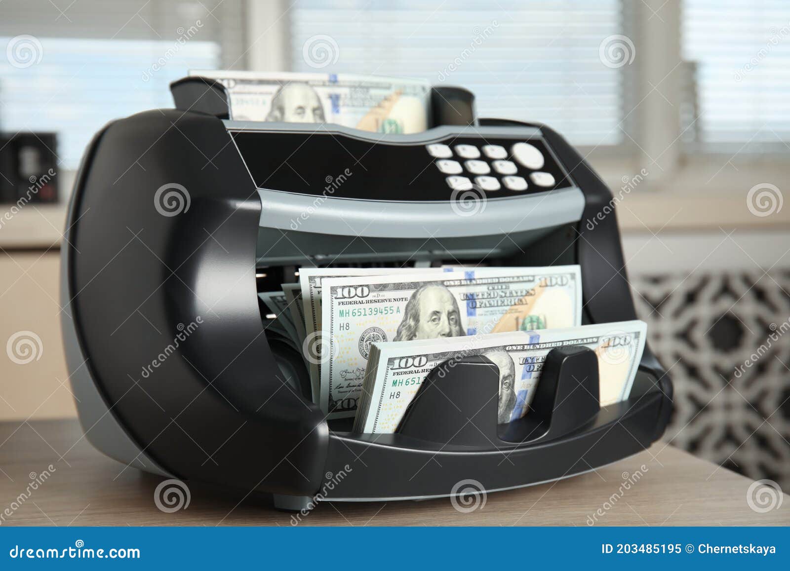 Modern Electronic Bill Counter with Money on Table Indoors, Closeup ...