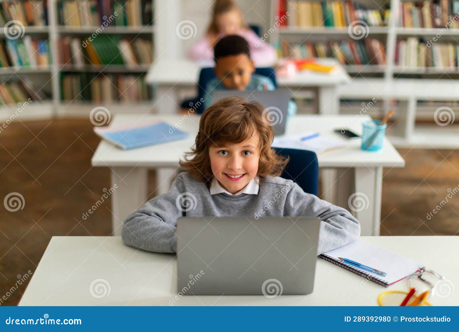 Modern Elementary Education. Happy School Children Sitting at Desks ...