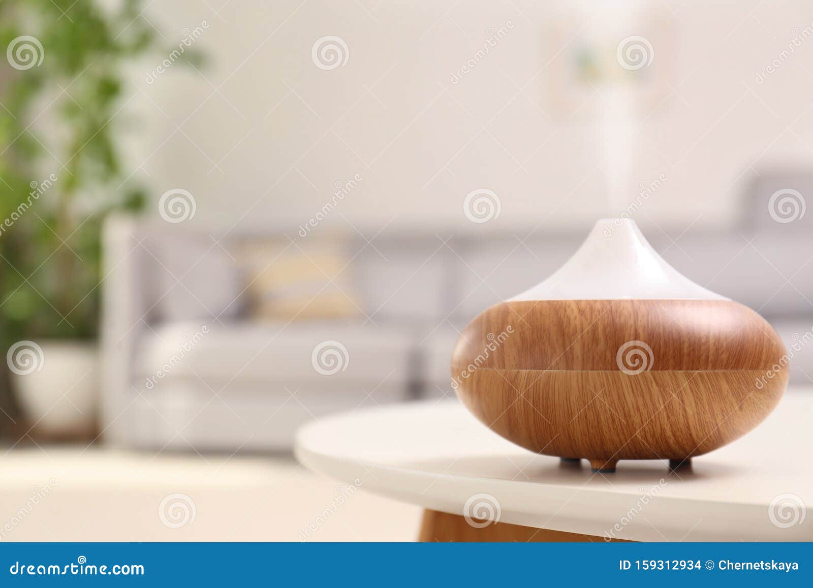 Modern Essential Oil Diffuser on Table. Space for Text Stock Photo ...