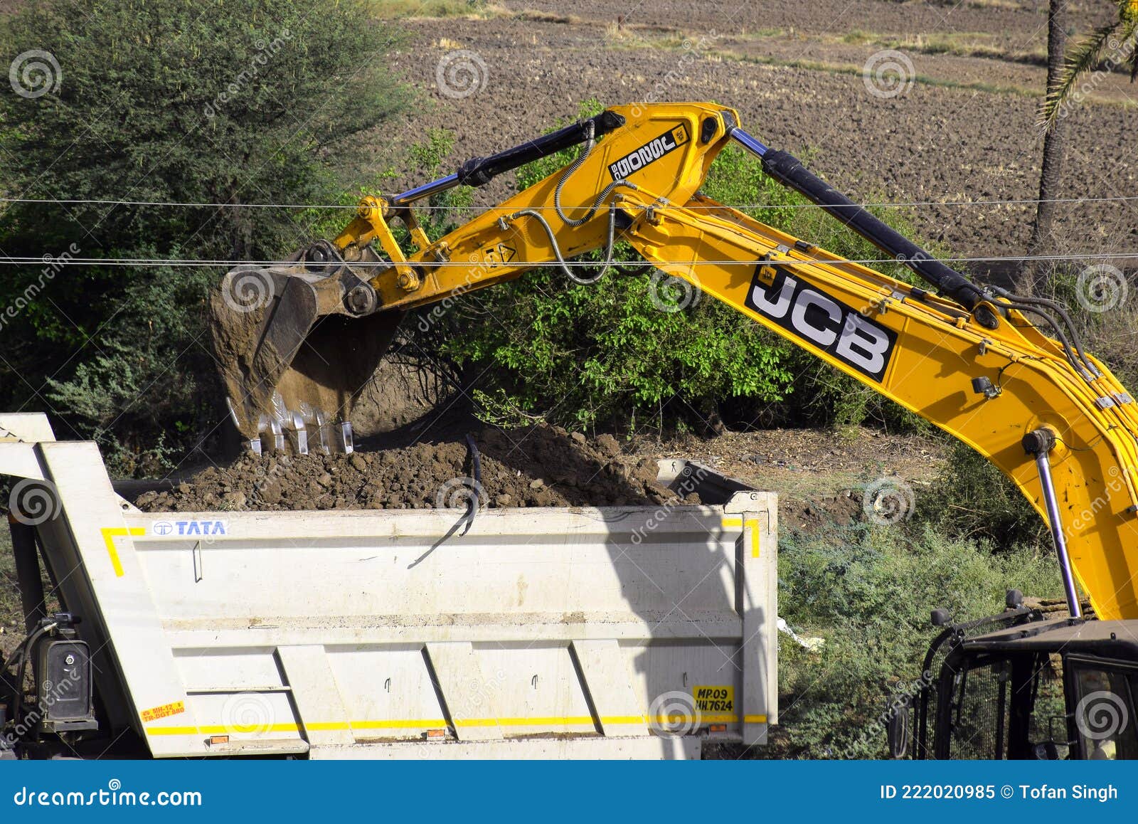 The Modern Excavator JCB Performs Excavation Work on the Construction ...