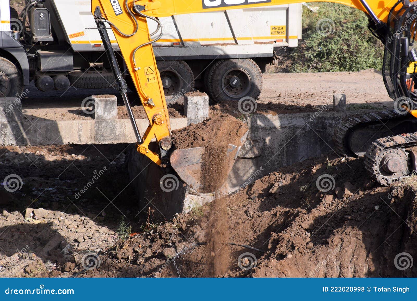 The Modern Excavator JCB Performs Excavation Work on the Construction ...