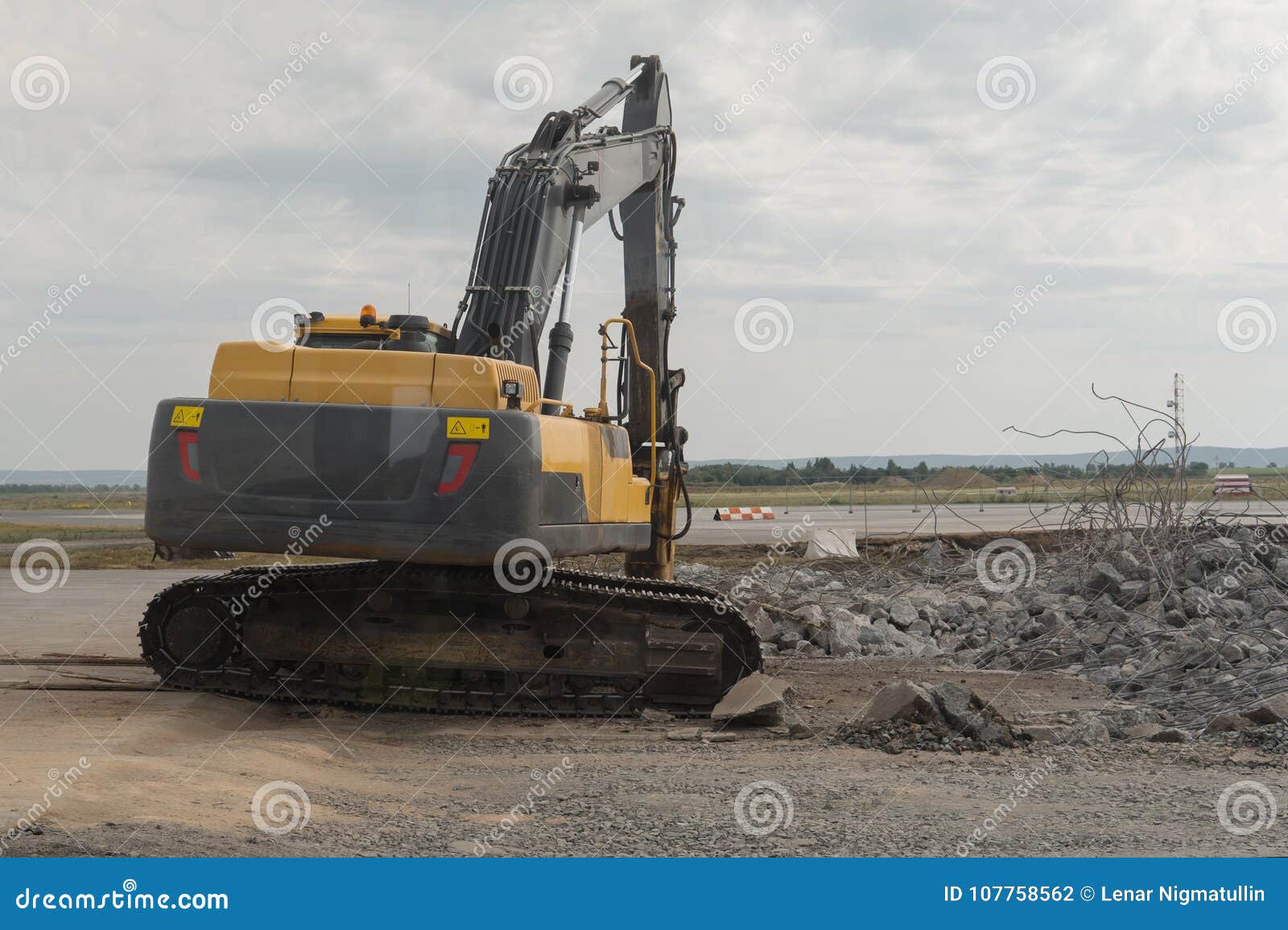 The Modern Excavator Performs Excavation Work on the Construction Site ...