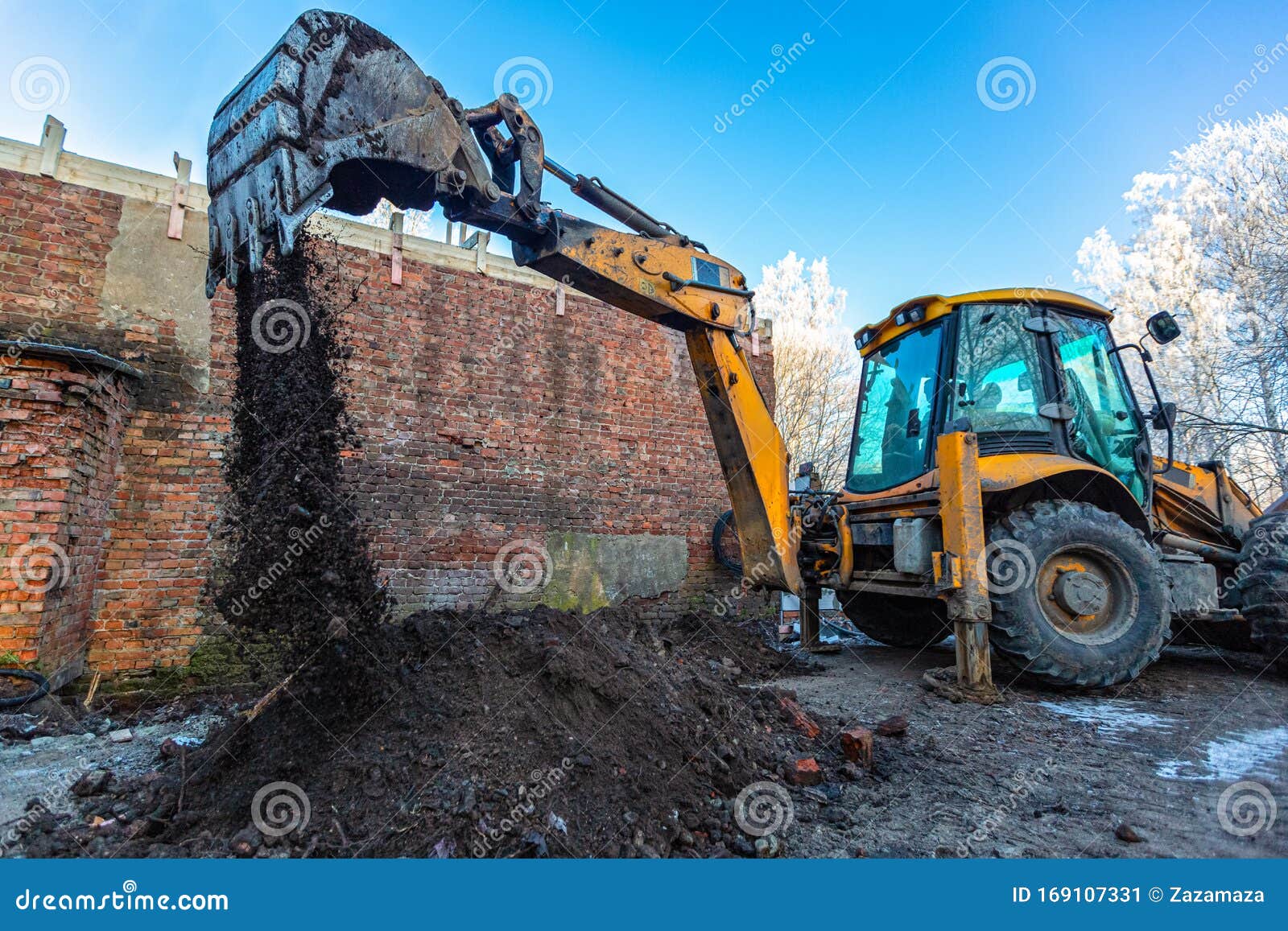 The Modern Excavator Performs Excavation Work on the Construction Site ...