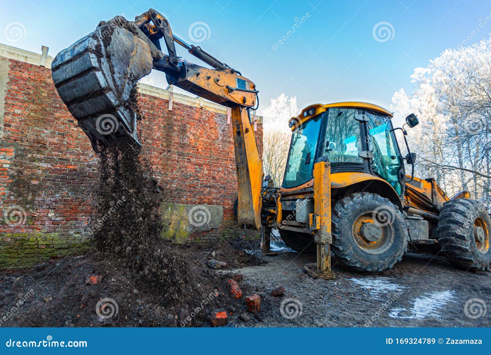 The Modern Excavator Performs Excavation Work on the Construction Site ...