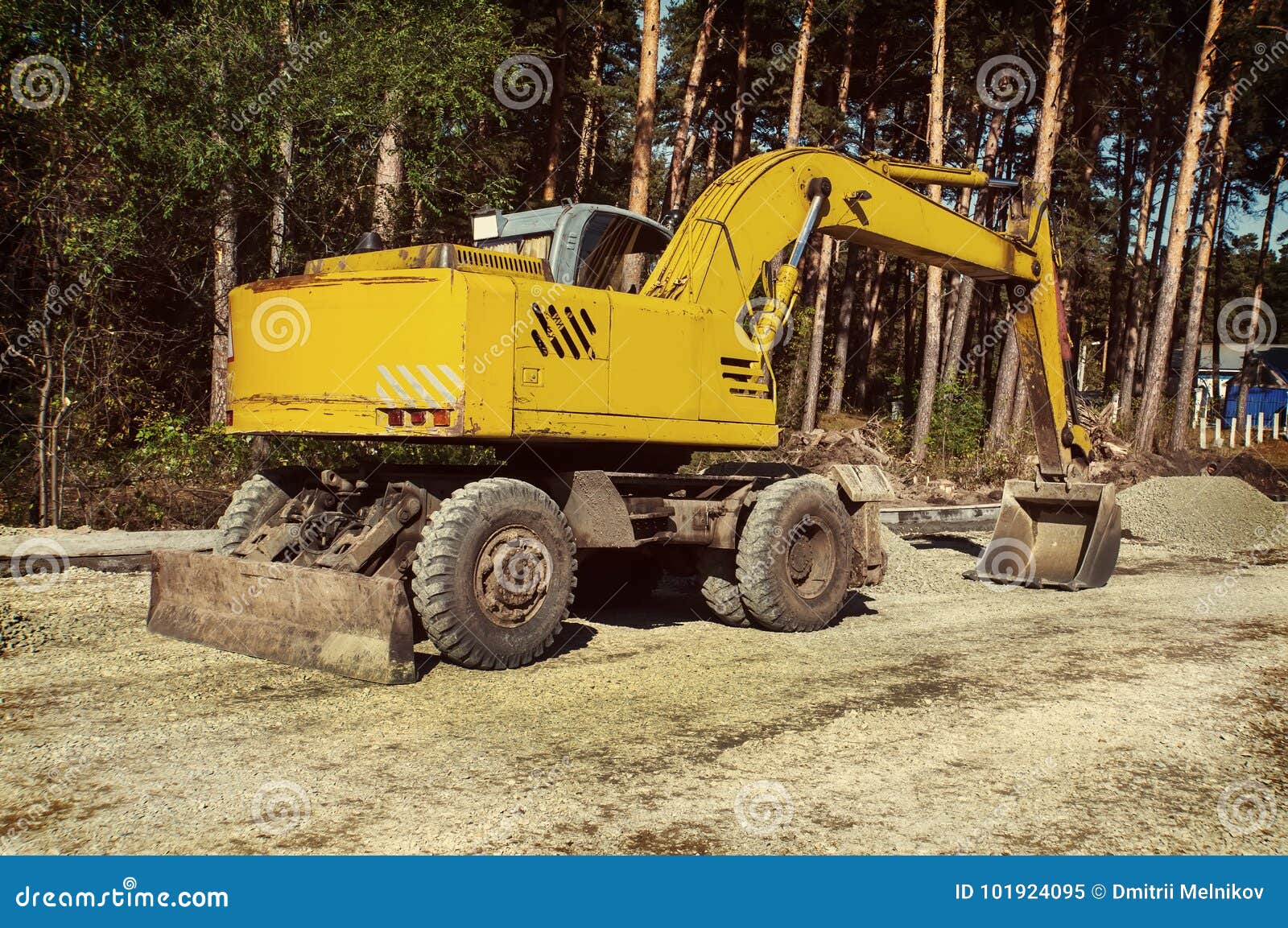 The Modern Excavator Performs Excavation Work on the Construction Site ...