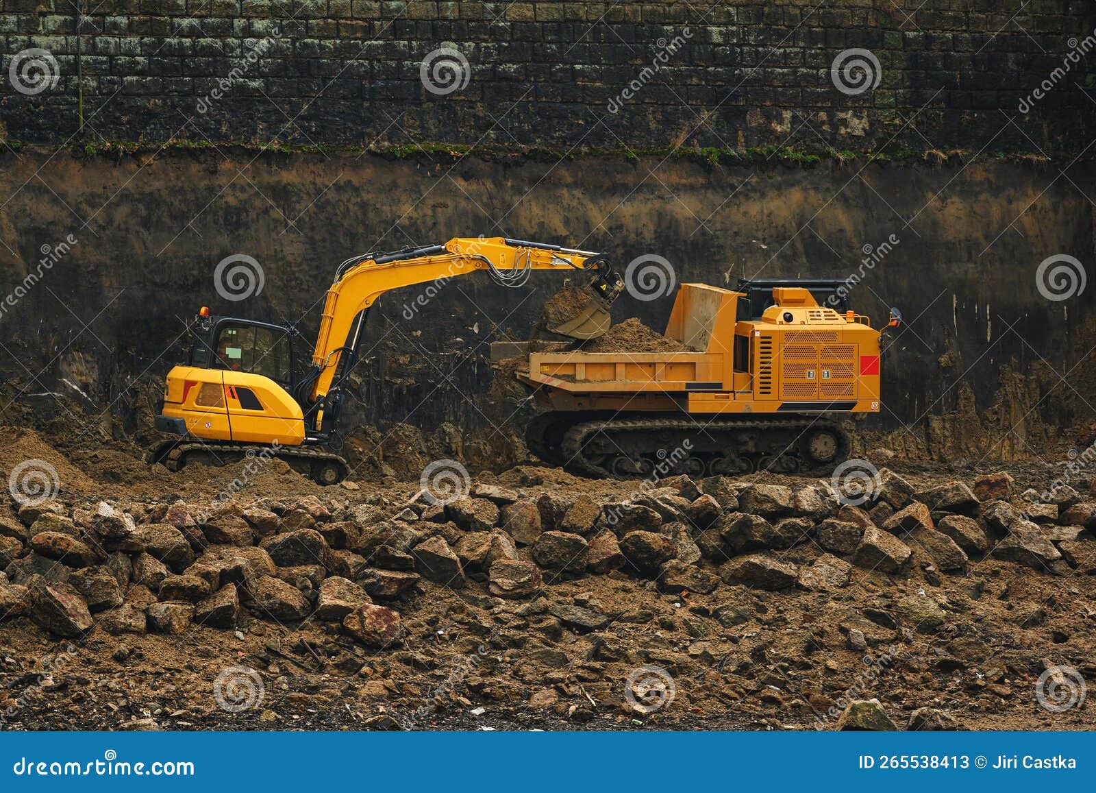 The Modern Excavator Performs Excavation Work on the Construction Site ...