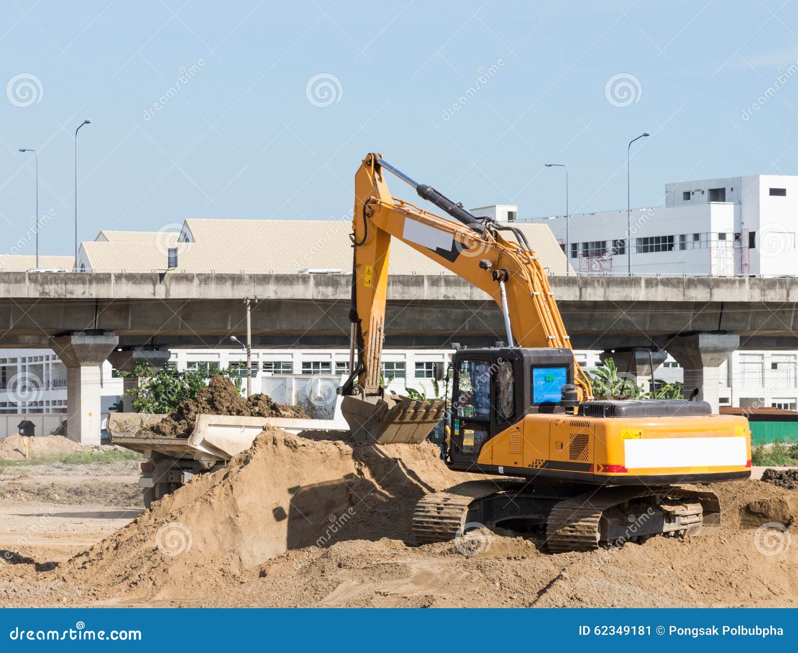 The Modern Excavator Performs Excavation Work On The Construction Site ...