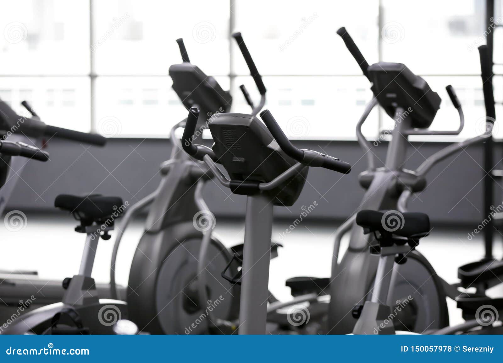 Modern Exercise Bicycles in Gym Stock Photo - Image of equipment, power ...