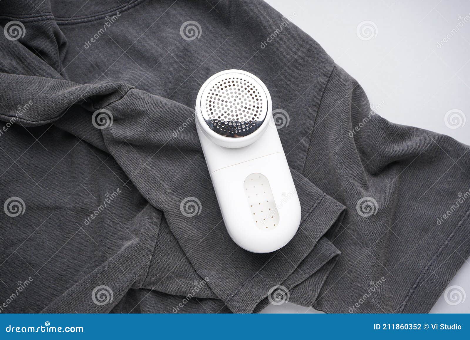 Modern Fabric Shaver and Clothes on Color Background, Top View Stock ...