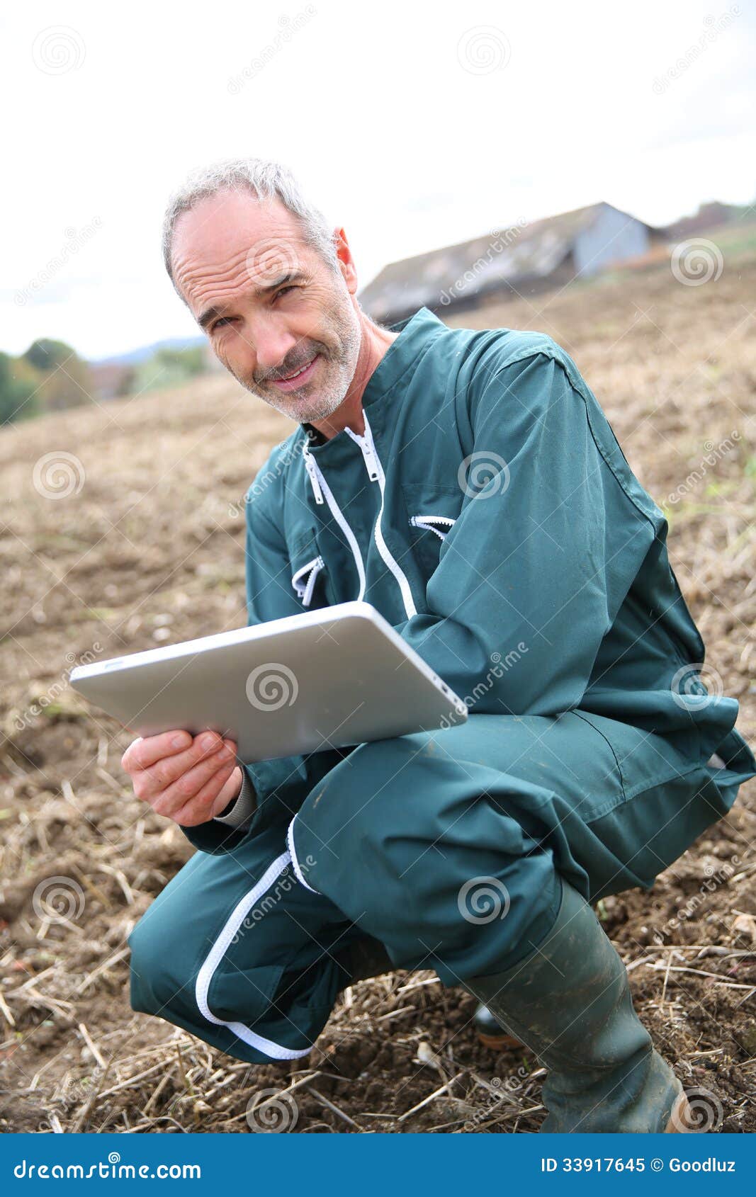 Modern Farmer Using Tablet in Middle of Field Stock Image - Image of ...