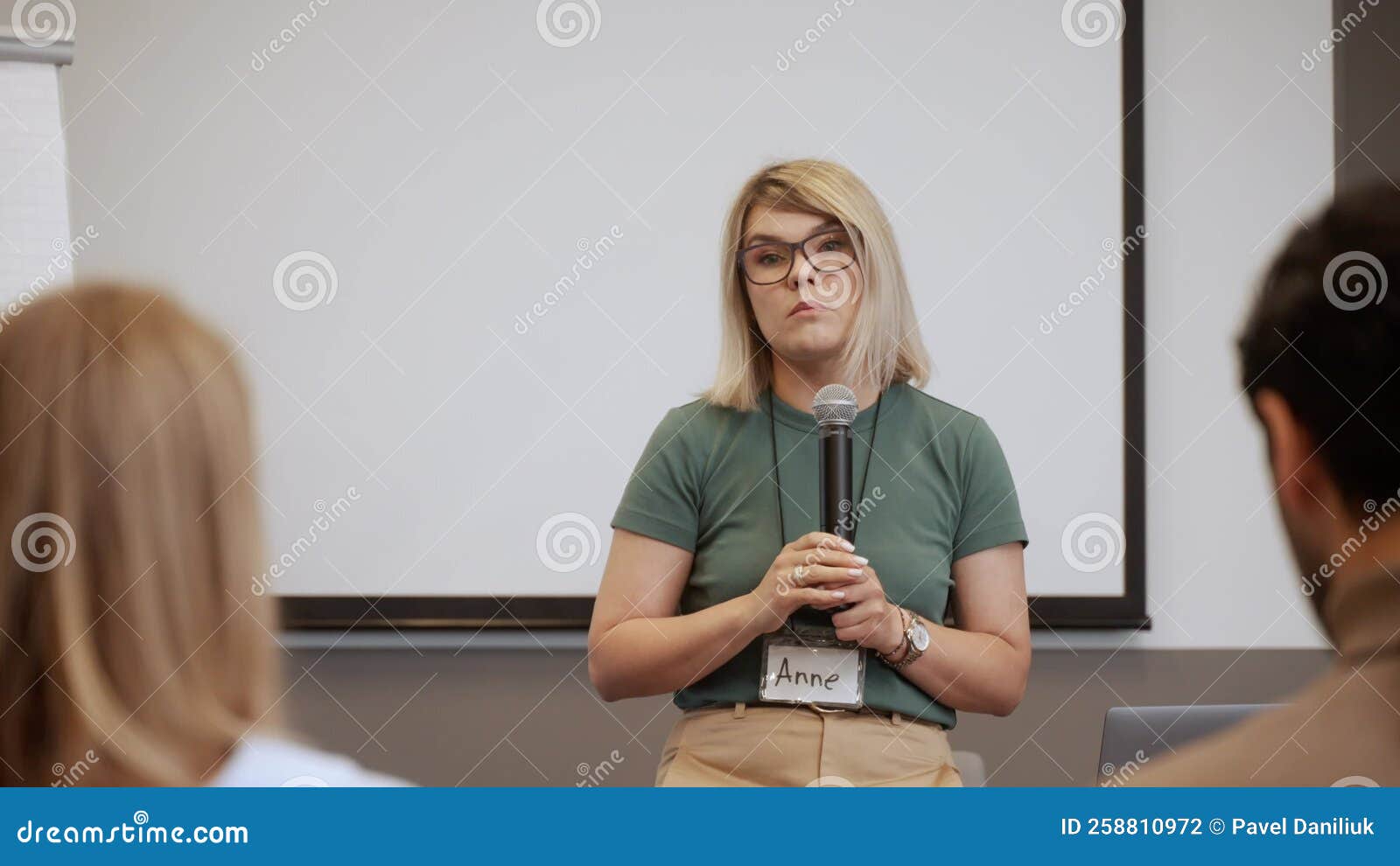 Modern Female Lecturer Talks with the Audience Using Microphone Stock ...
