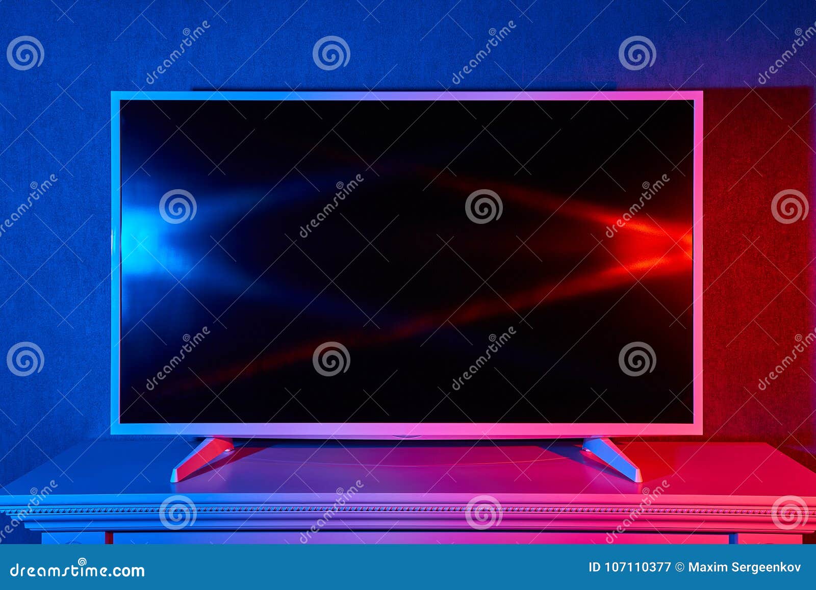 A Flat TV Lit with Red and Blue Colors Stock Image - Image of ...