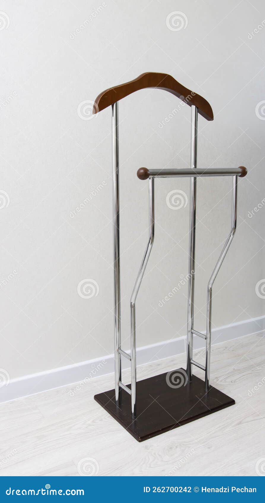 Modern Floor Standing Suit Rack Against a White Wall Stock Photo ...