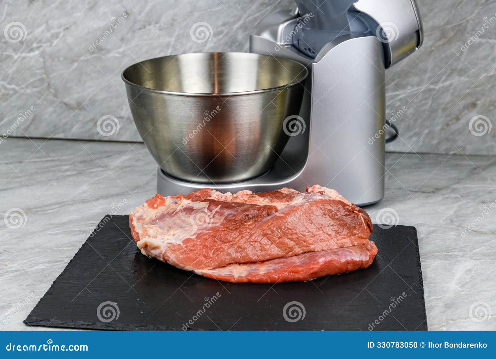 Modern Food Processor with Meat Grinder and Peace of Pork Meat on a ...