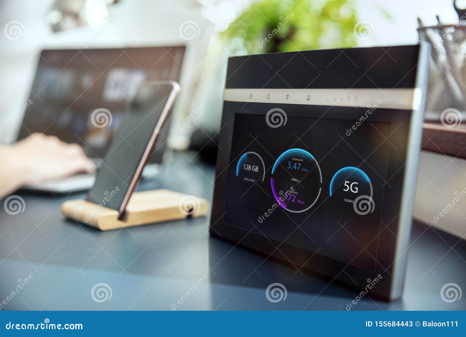 Modern 5G Wi-fi Router with Display on the Desk and Devices on the ...