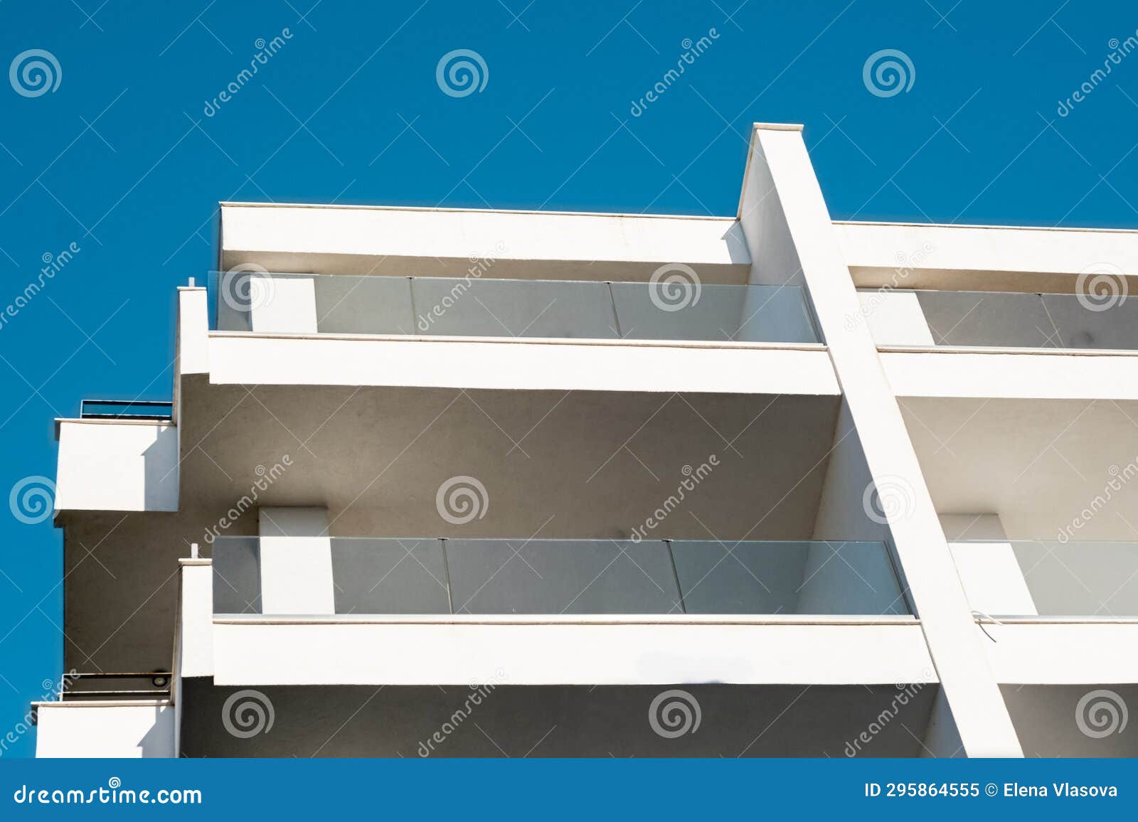 Modern Geometric Building Against Blue Sky in Low Angle and Perspective ...