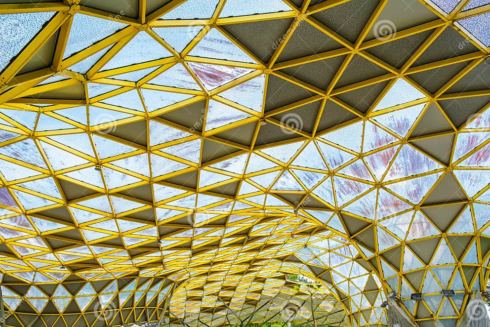 Modern Geometric Yellow Lattice Roof Structure with a Repetitive ...