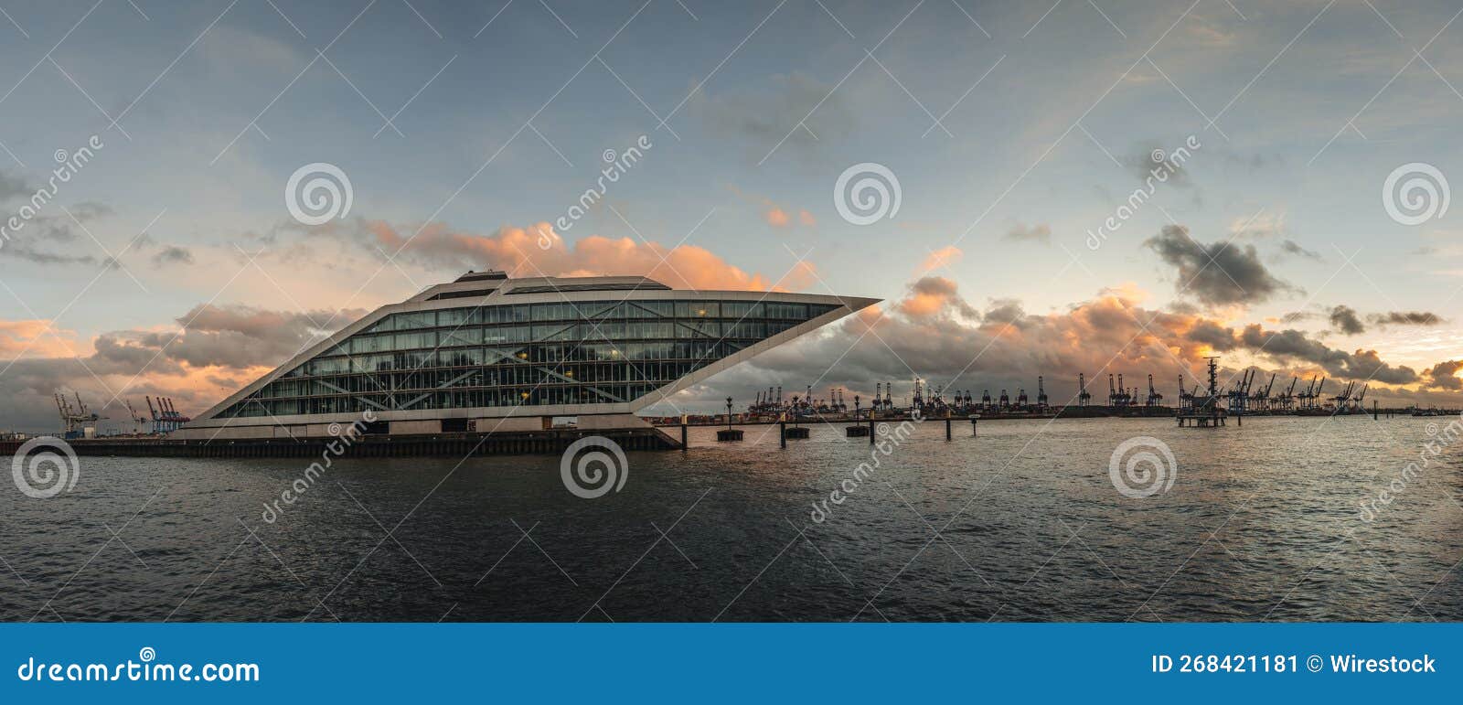 Modern Glass Building at the Coast of the Water with Sunset in the ...