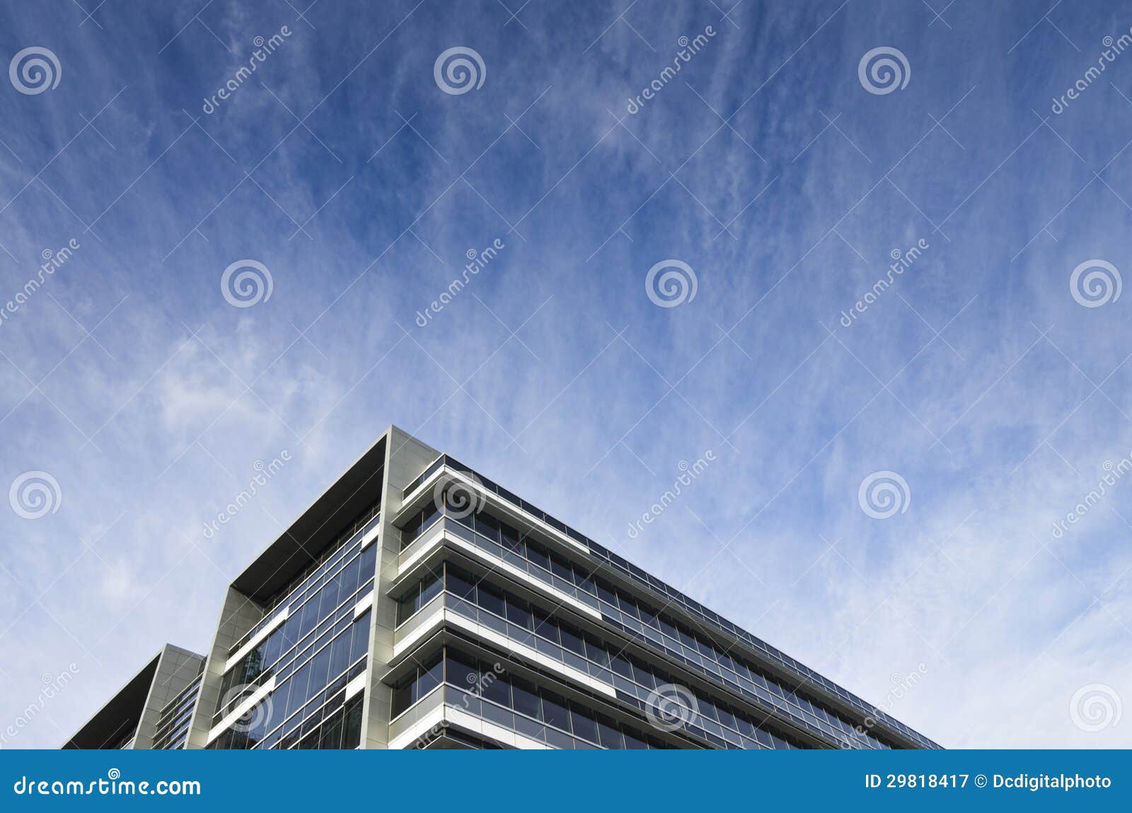 Modern Glass Building Under a Dramatic Sky Stock Image - Image of blue ...