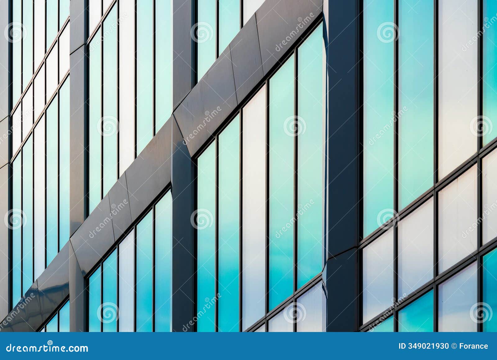 Modern Glass Facade with Reflective Panels and Angular Architectural ...