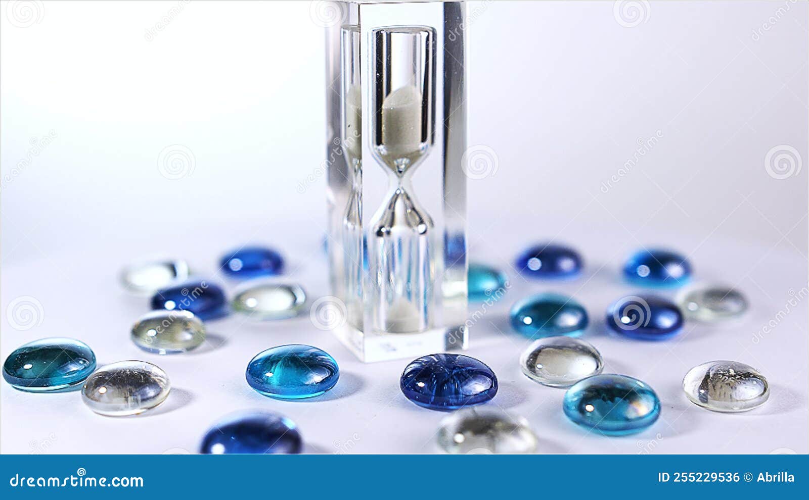 Modern Glass Hourglasses Rotate Against a White Background Stock Photo ...