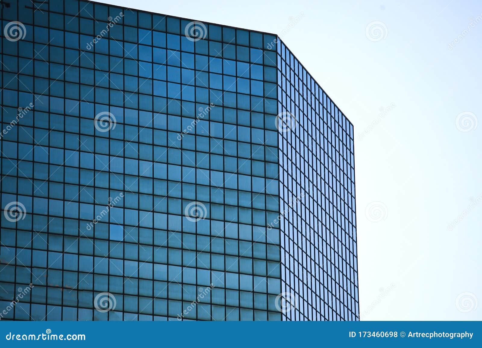 Modern Glass Office Building with Multiple Windows on the Blue Sky ...