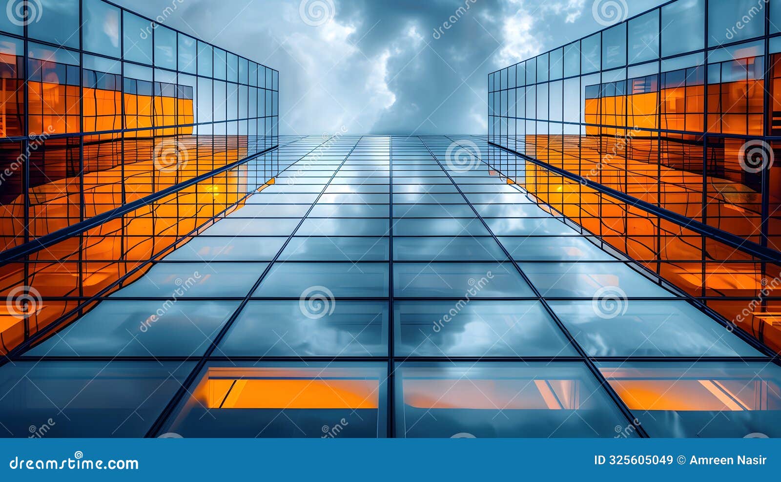 Modern Glass Skyscraper Faced with Reflections of Blue Sky and Orange ...