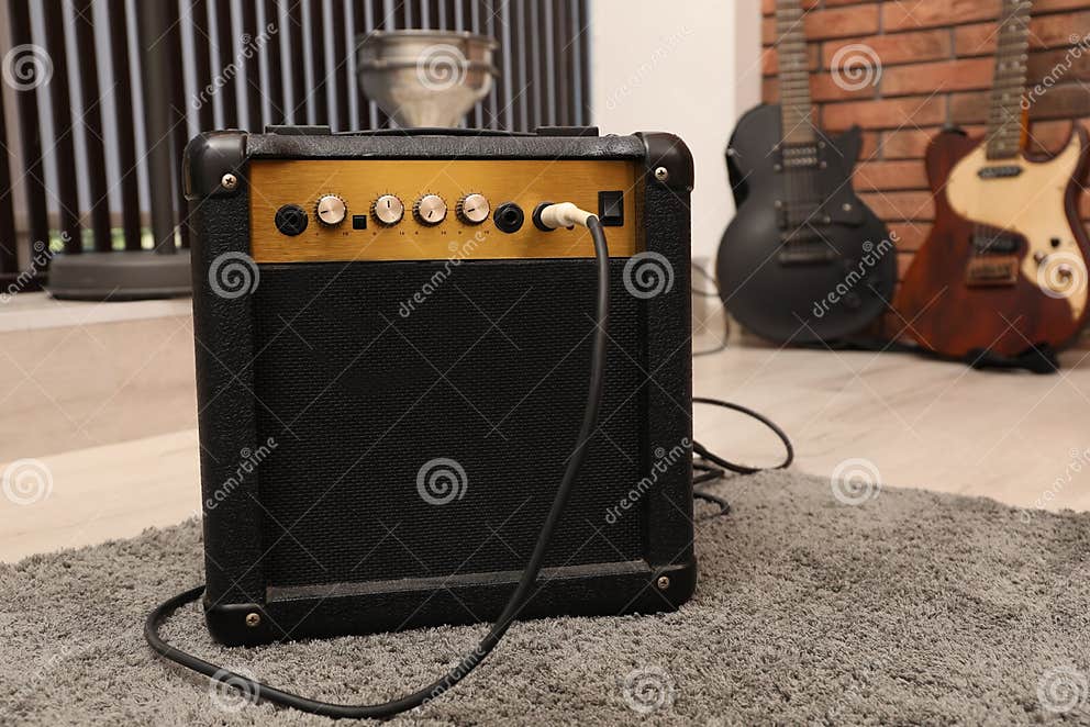 Modern Guitar Amplifier on Floor in Studio Stock Photo - Image of ...
