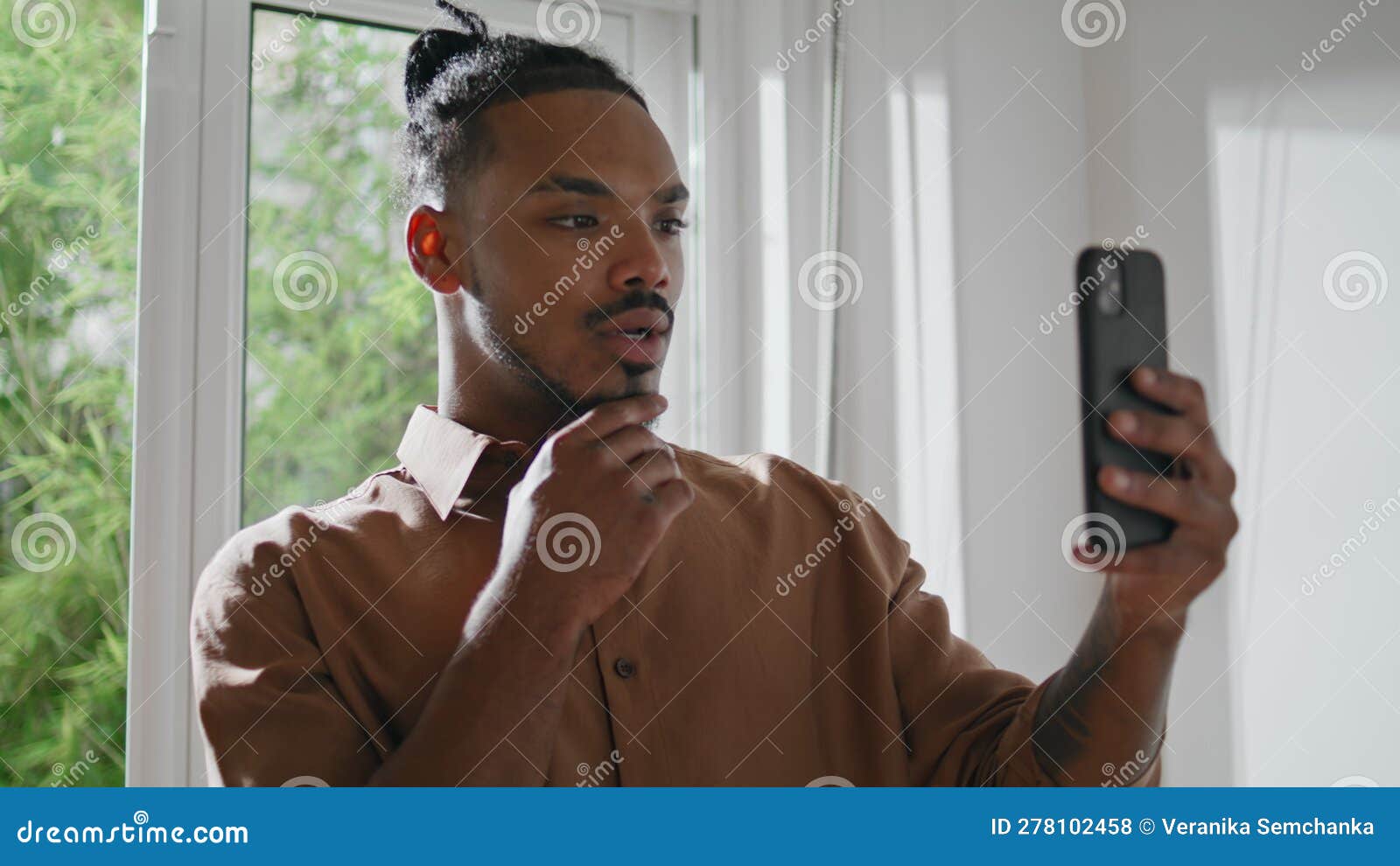 Modern Guy Explaining Smartphone Video Call Closeup. Young Man Looking ...