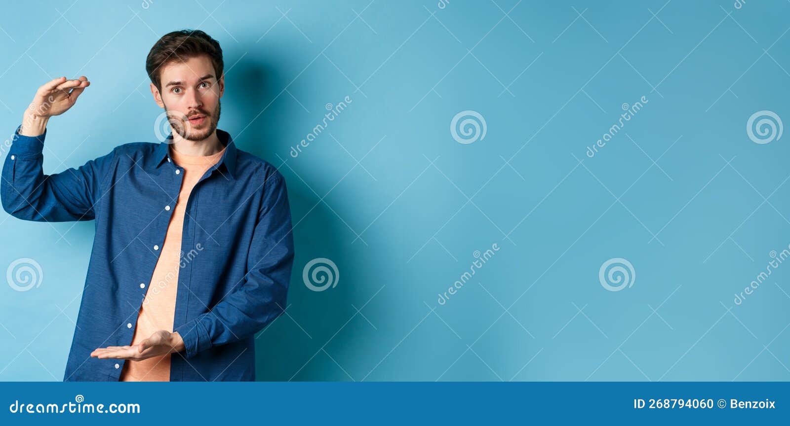 Modern Guy Showing Big Size, Shaping Large Object and Looking Impressed ...